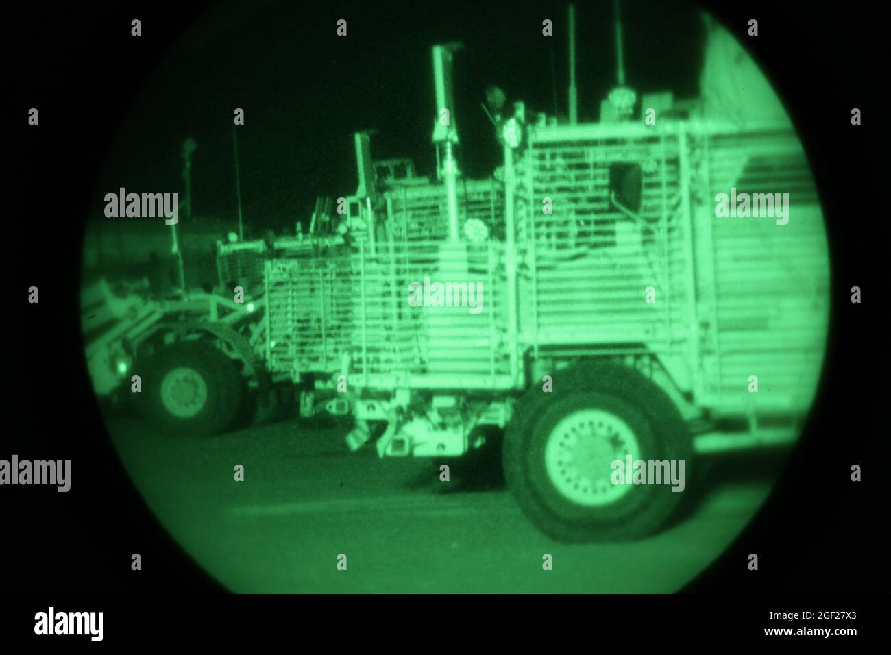 Mine-resistant, ambush-protected (MRAP) vehicles sit on the flight line ...