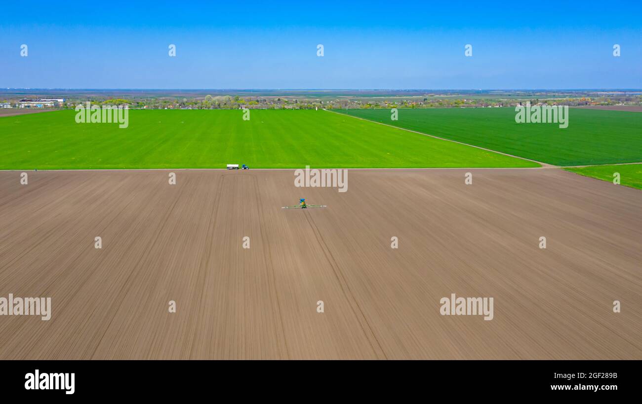 Above view, overhead view on tractor until spraying big endless ...