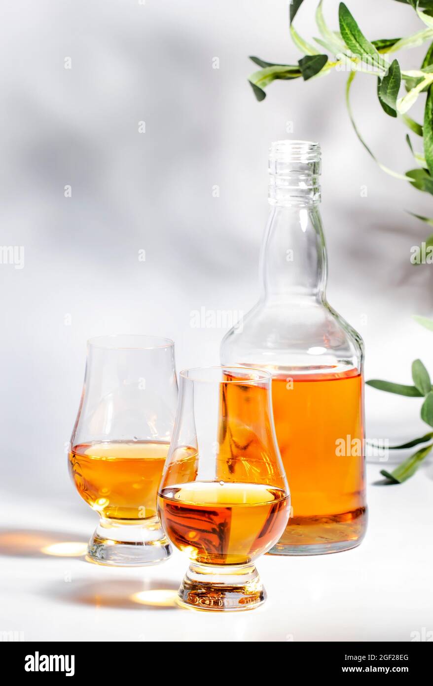Scotch Whiskey in special glasses and bottle, white background with ...