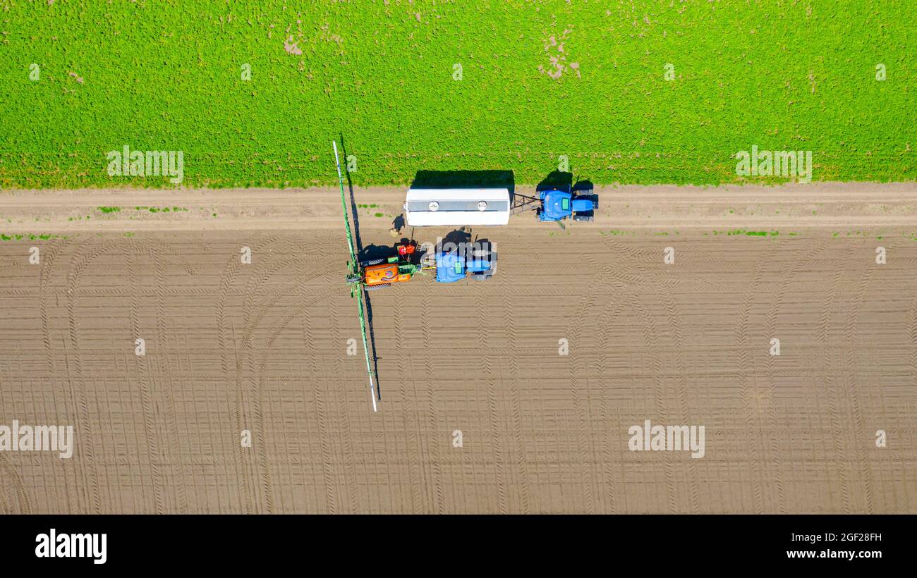 Above top view, overhead view on two farmers as they preparing, mixing ...
