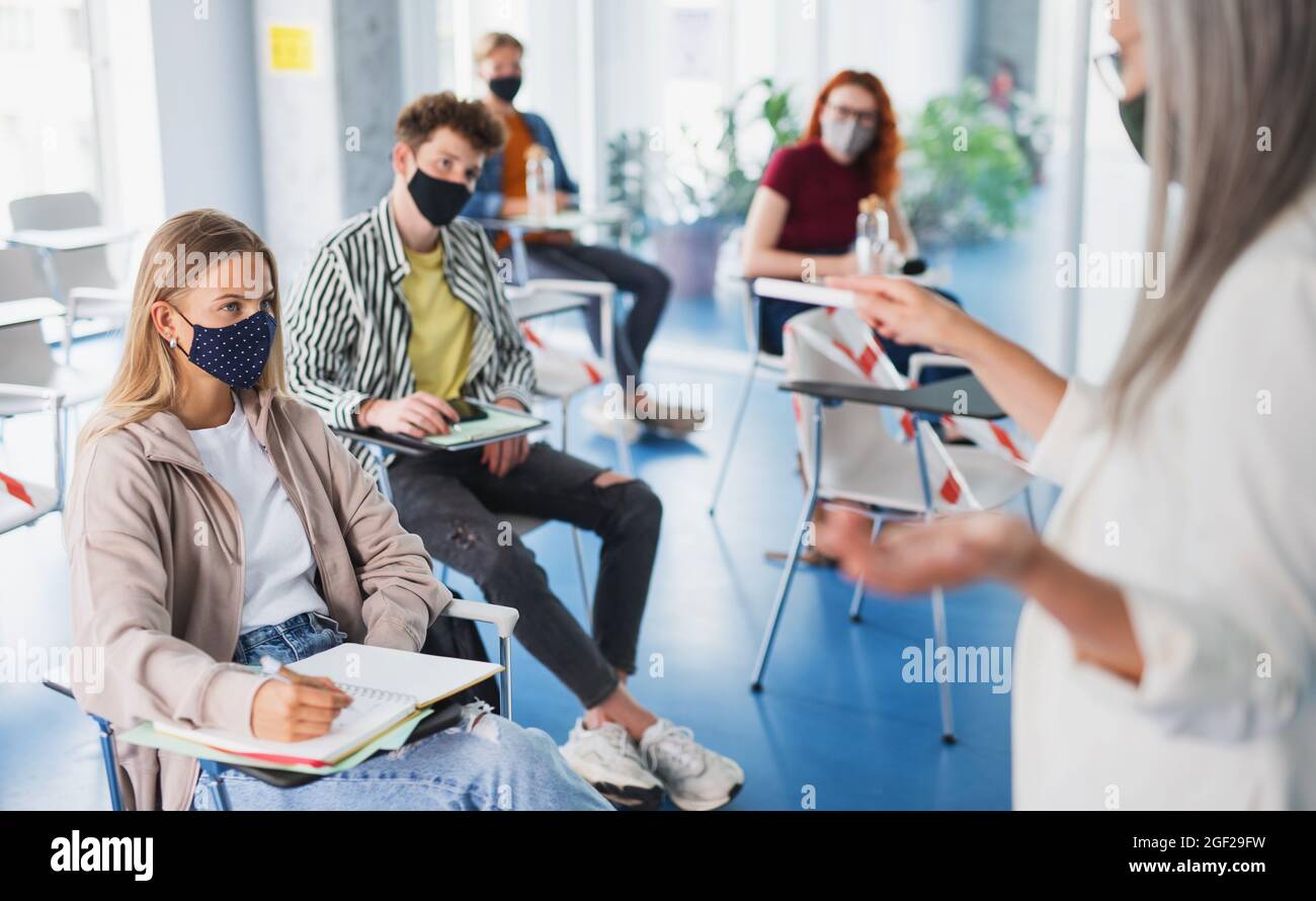 Portrait of university student in classroom indoors, coronavirus and ...