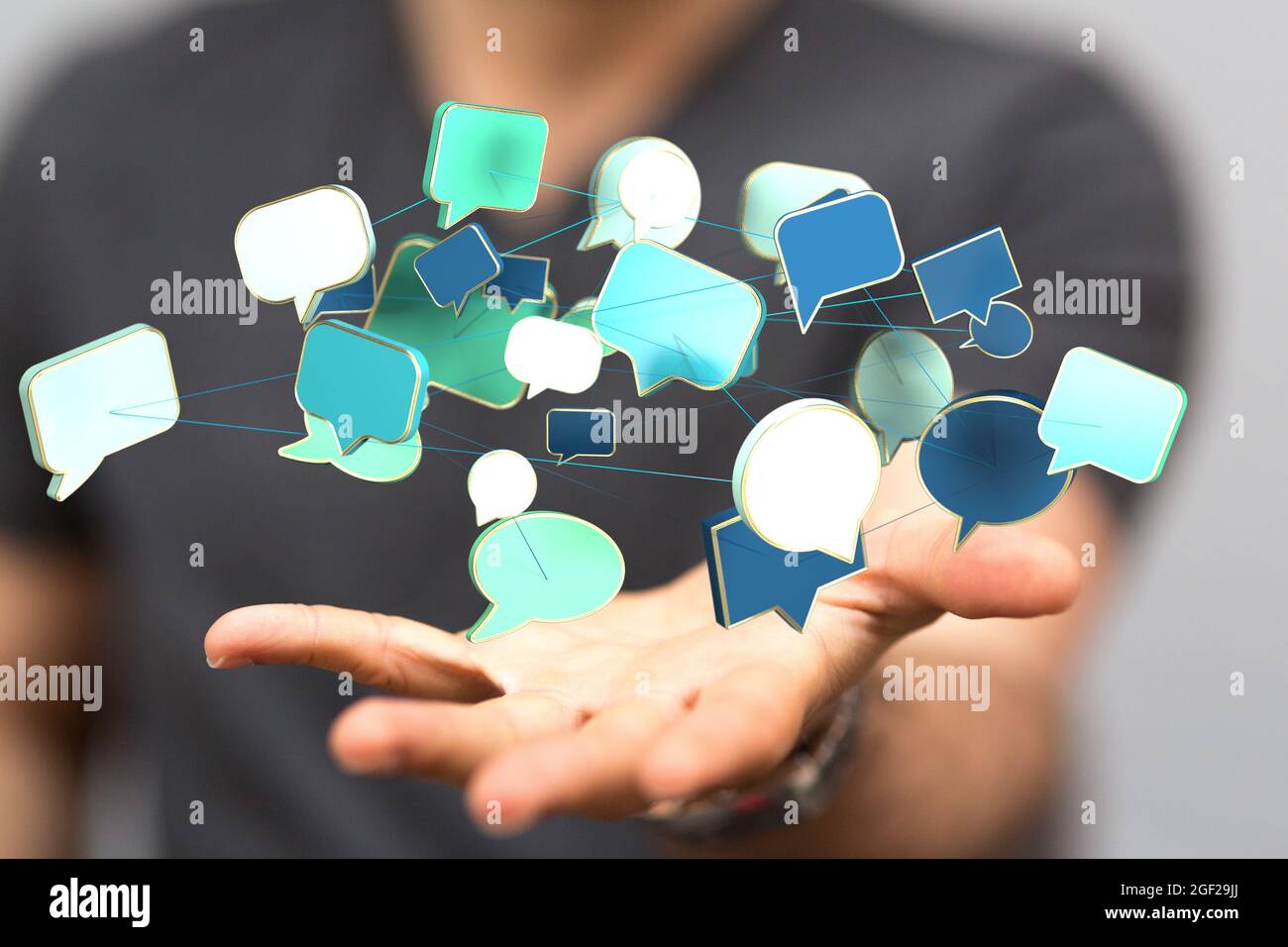 Businessman's hand holding colorful communication icons Stock Photo - Alamy