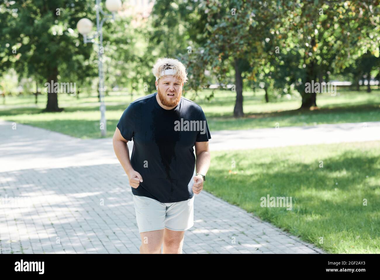 Overweight man jogging hi-res stock photography and images - Alamy