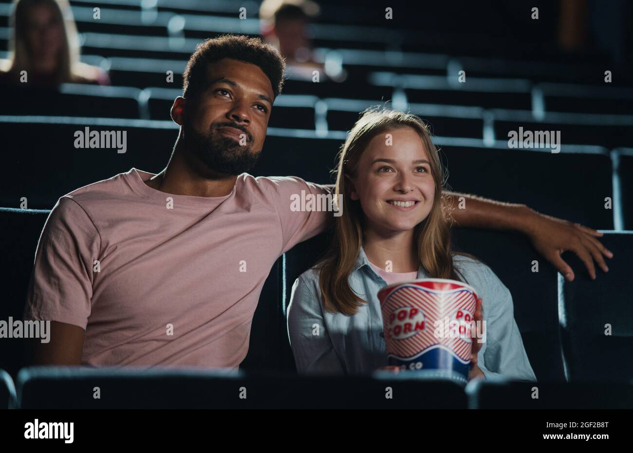 African couple popcorn watching hi-res stock photography and images - Alamy