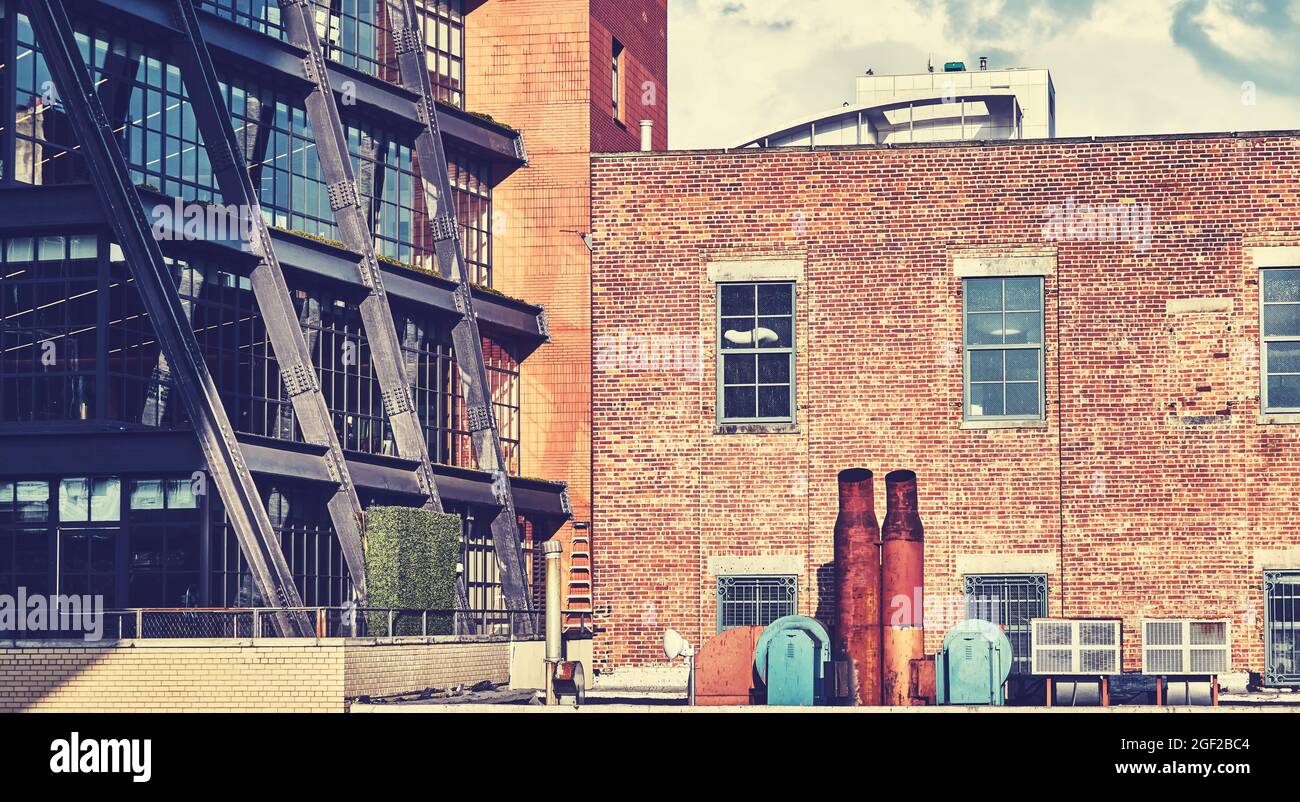 Urban scene with rusty exhaust pipes, color toning applied, New York ...