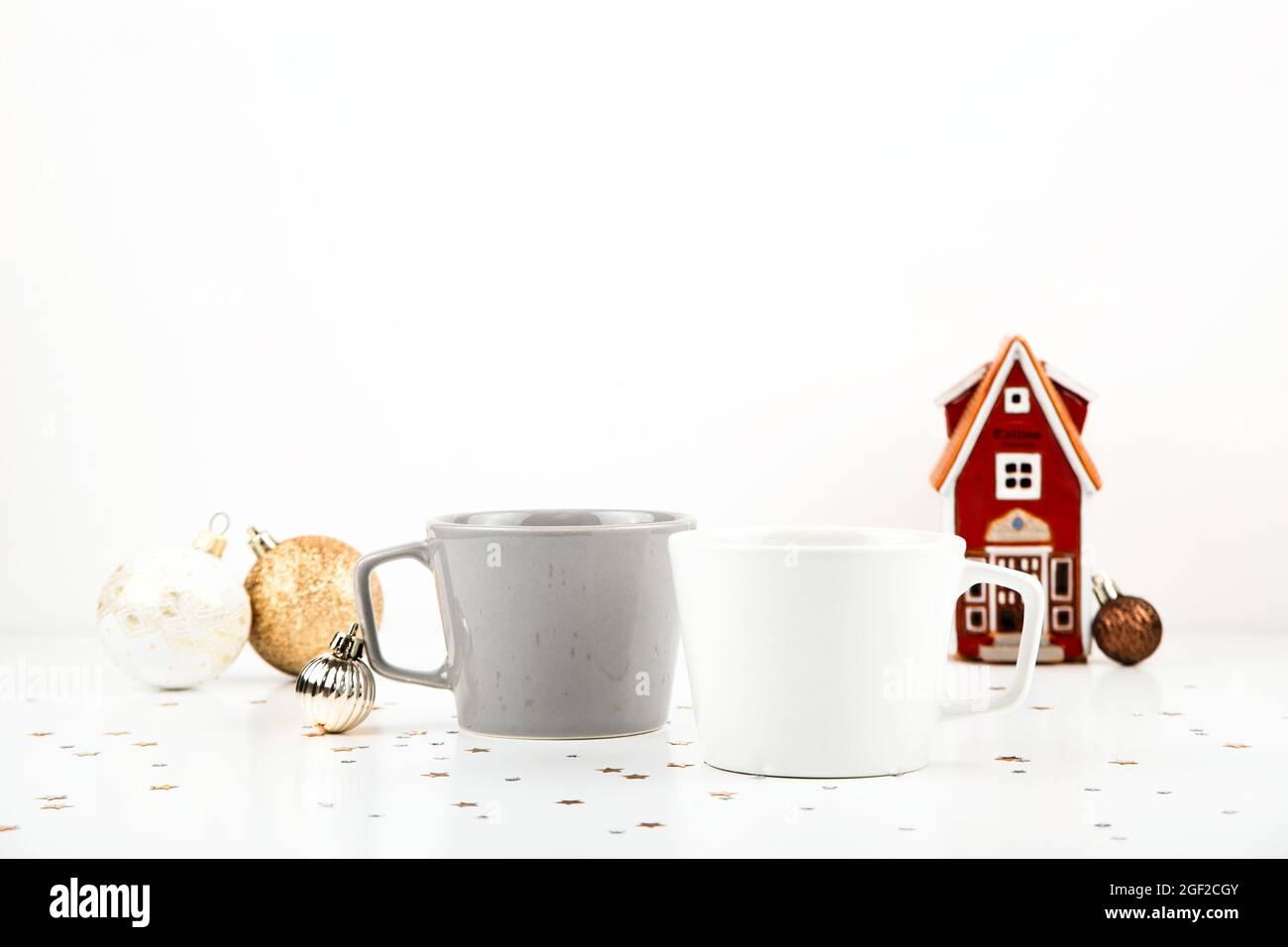 White and gray empty cup mockup on light background with Christmas ...