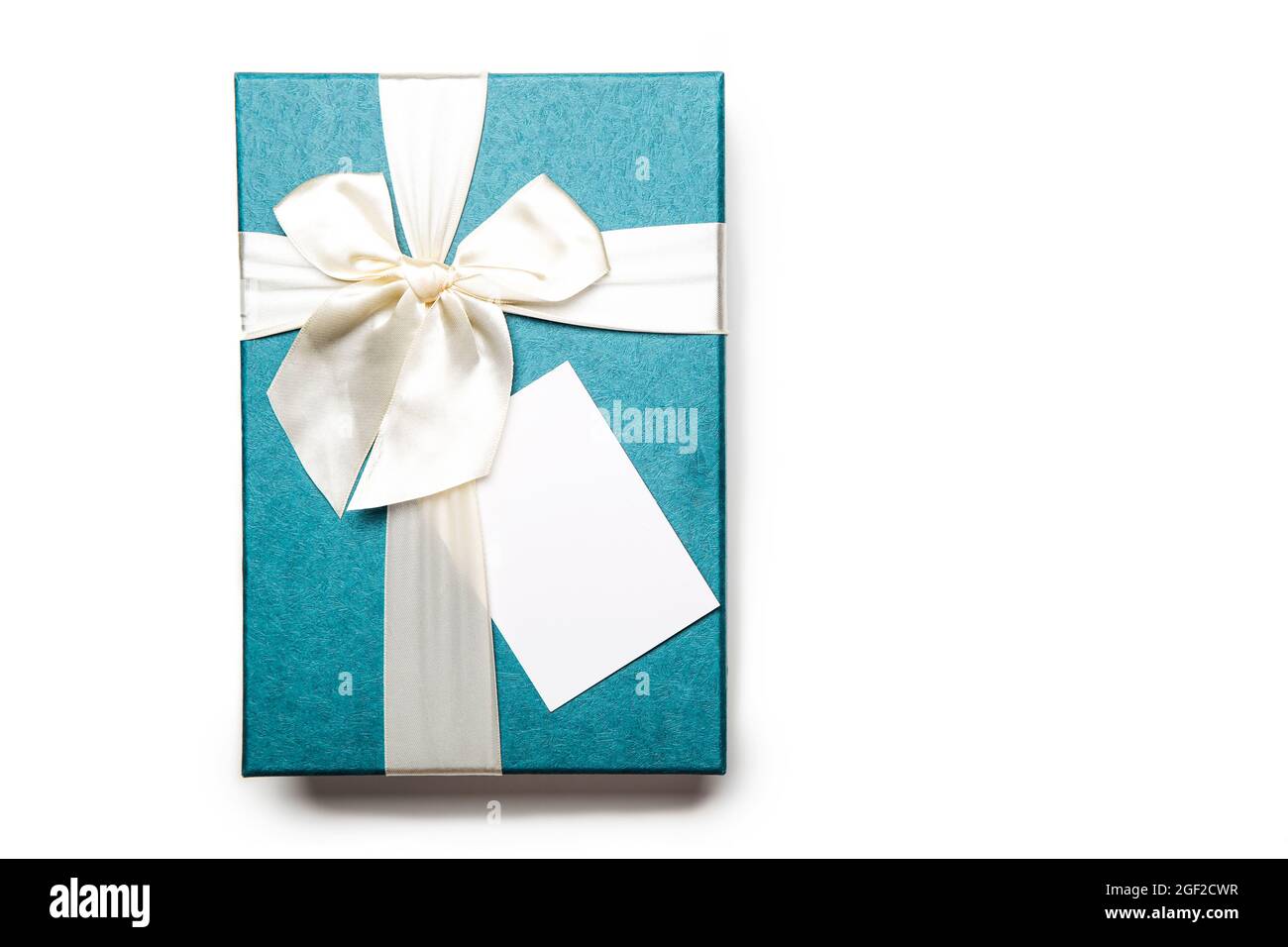 Gift box with empty white blank gift tag mock up. Christmas, birthday ...