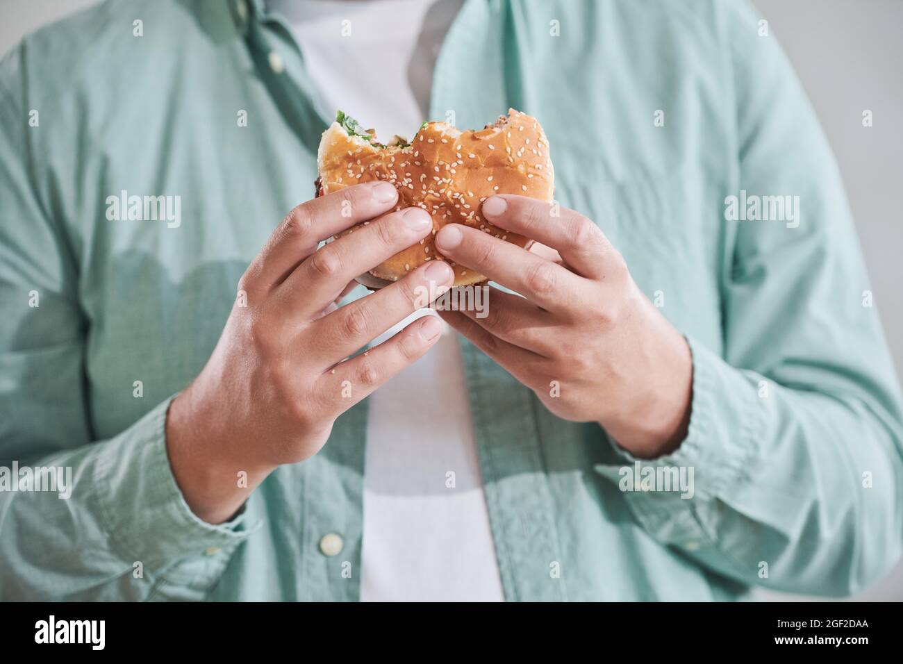 Man Holding Burger High Resolution Stock Photography and Images - Alamy