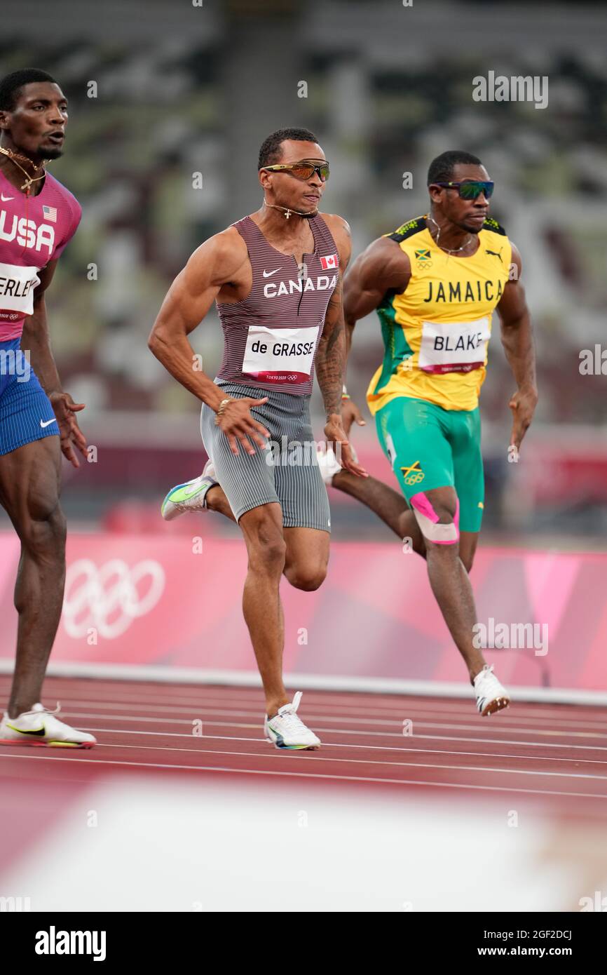 Andre De Grasse running the 100 meters at the 2020 Tokyo Olympics Stock ...