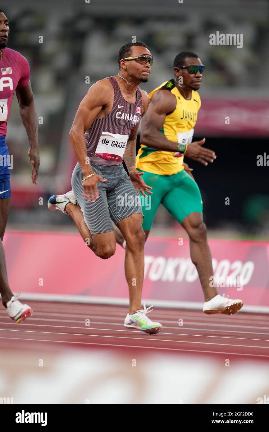 Andre De Grasse running the 100 meters at the 2020 Tokyo Olympics Stock ...