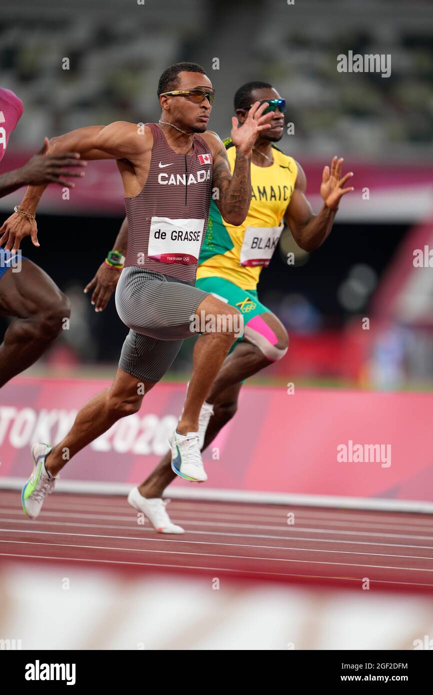 Andre De Grasse running the 100 meters at the 2020 Tokyo Olympics Stock ...