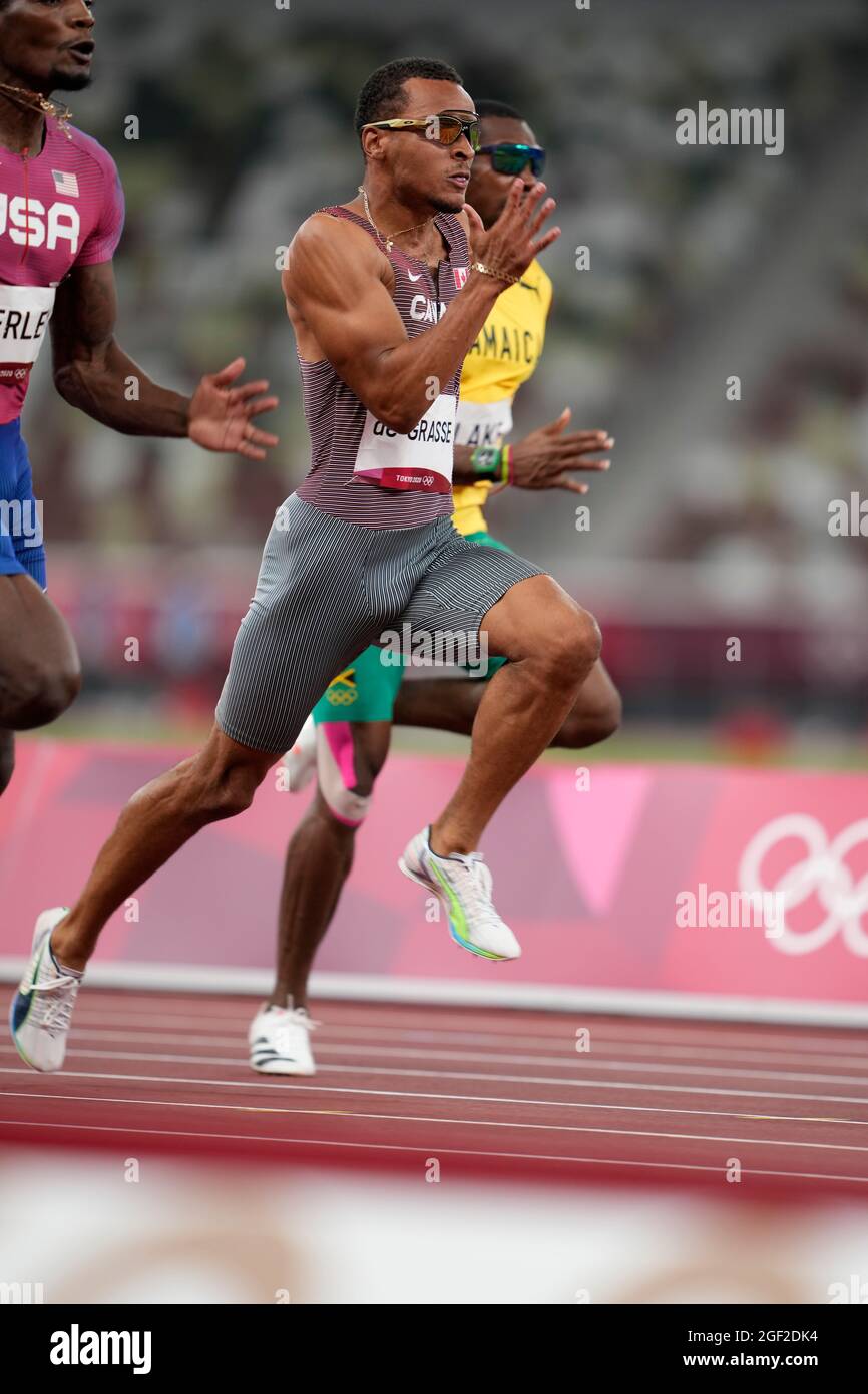 Andre De Grasse running the 100 meters at the 2020 Tokyo Olympics Stock ...