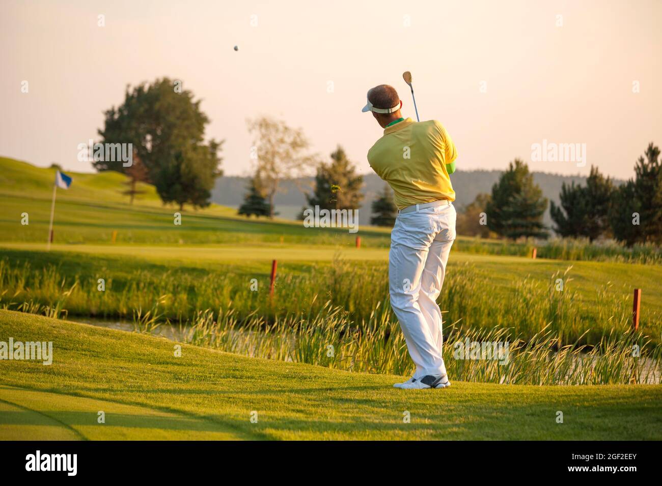 Boy playing golf red ball hi-res stock photography and images - Alamy