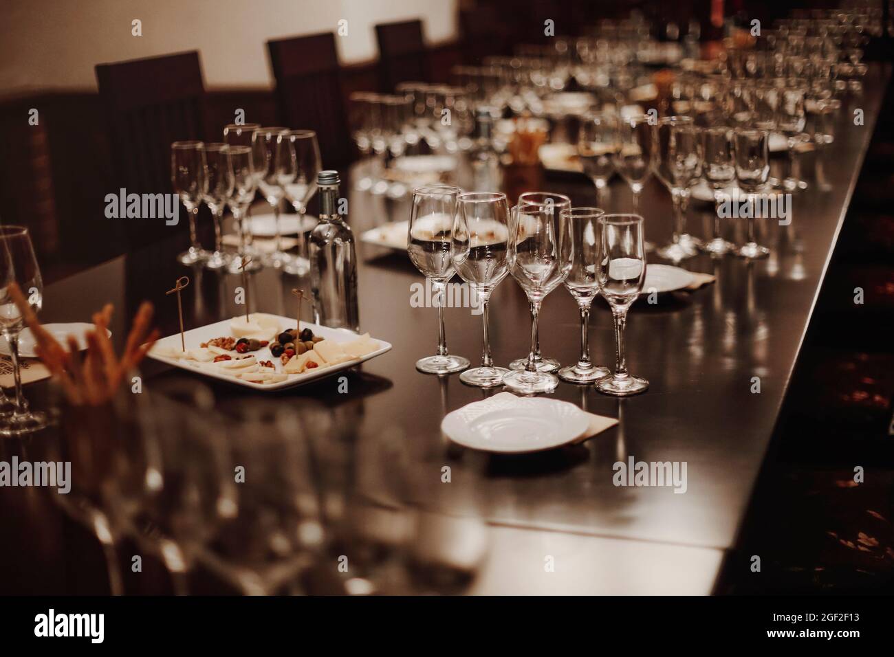 Glass goblets placed in rows on table during wine tasting procedure in ...