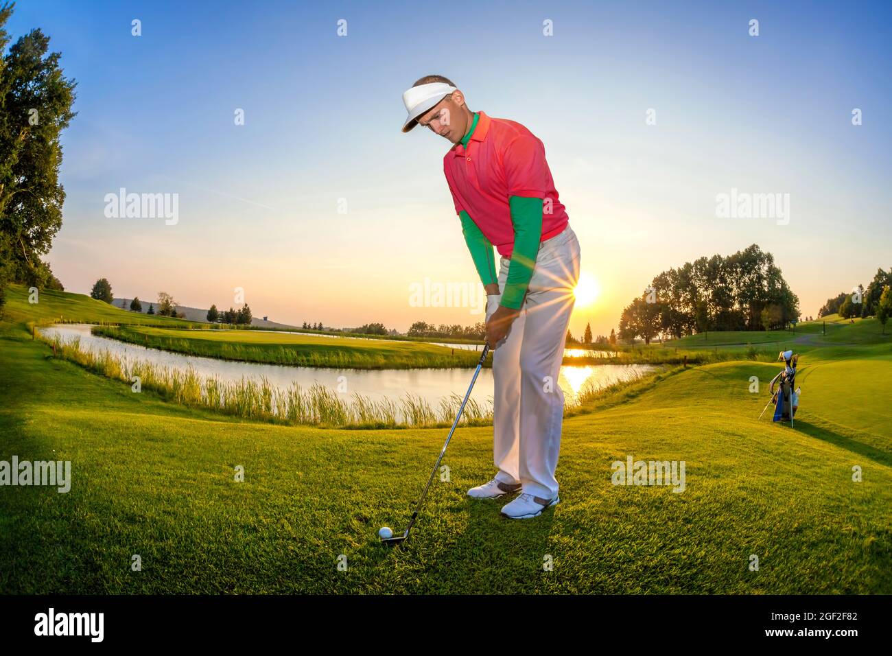 Boy playing golf red ball hi-res stock photography and images - Alamy