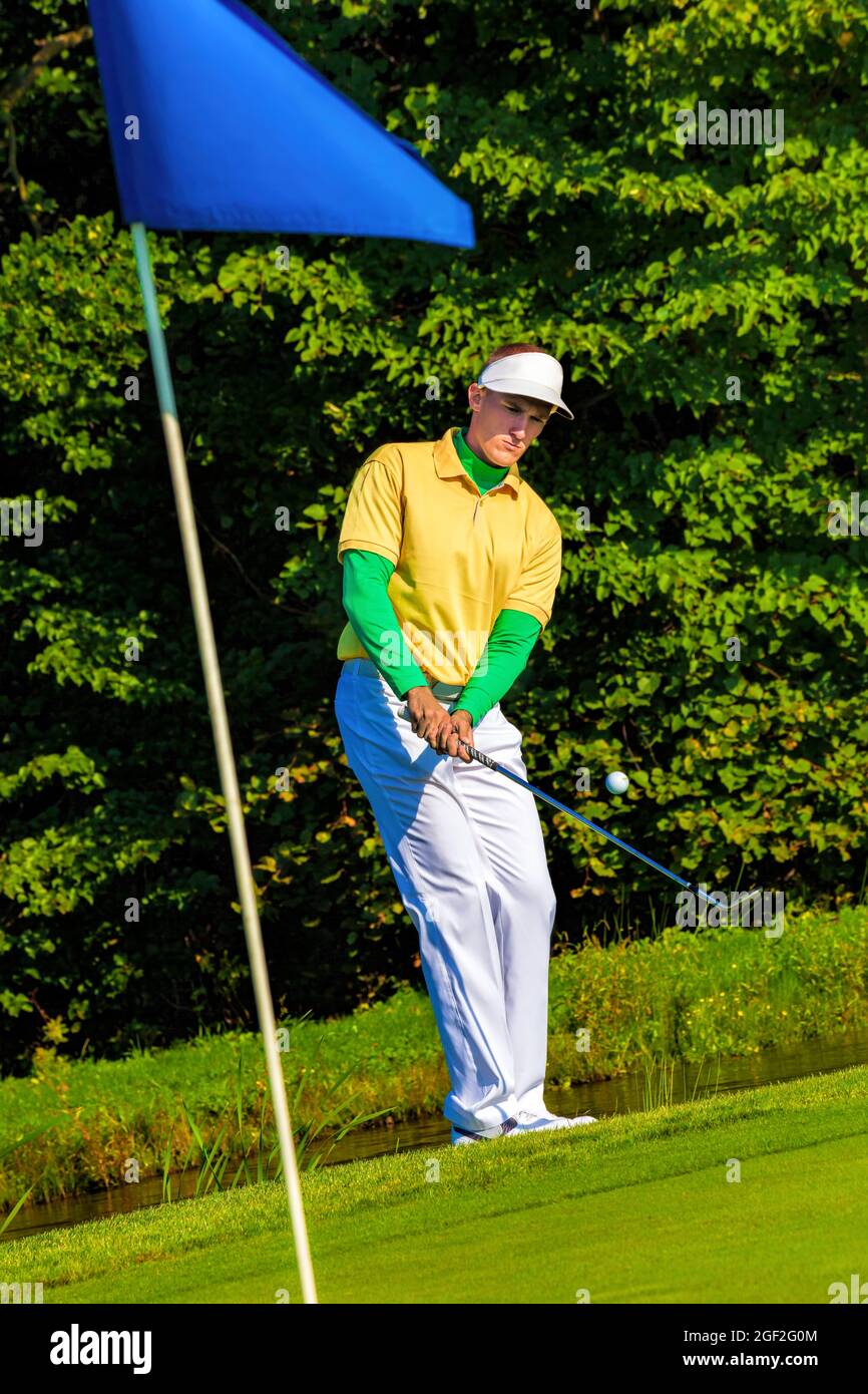 Boy playing golf red ball hi-res stock photography and images - Alamy
