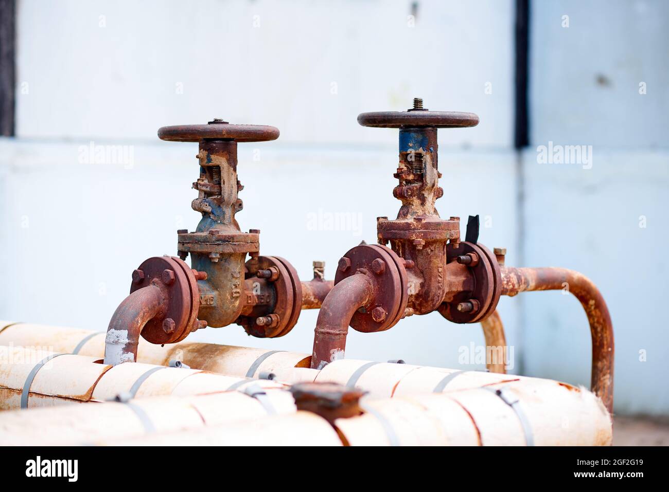 Two rusty street pipe valves Stock Photo - Alamy