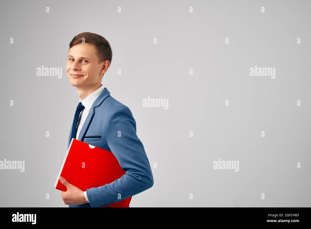 man in suit with red folder documents office official Stock Photo - Alamy