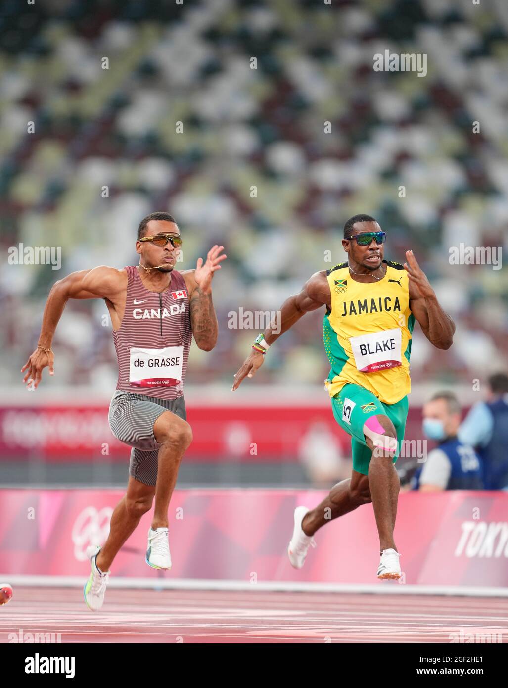 Andre De Grasse running the 100 meters at the 2020 Tokyo Olympics Stock ...
