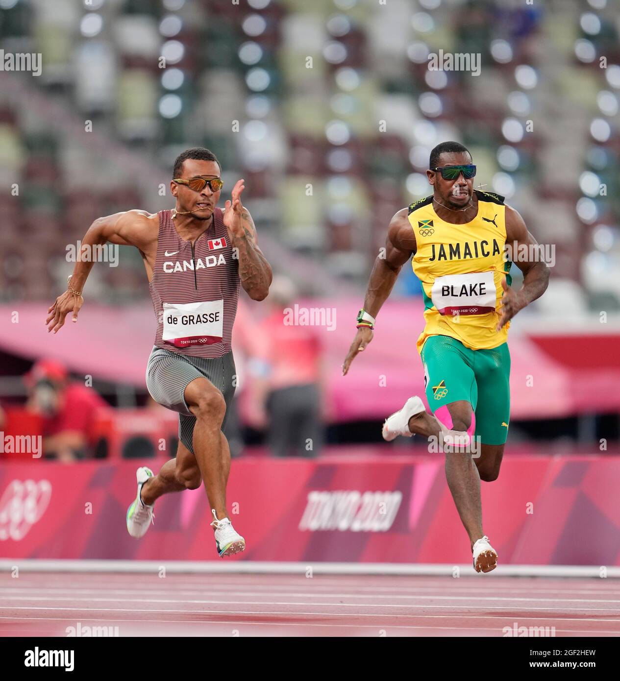 Andre De Grasse running the 100 meters at the 2020 Tokyo Olympics Stock ...