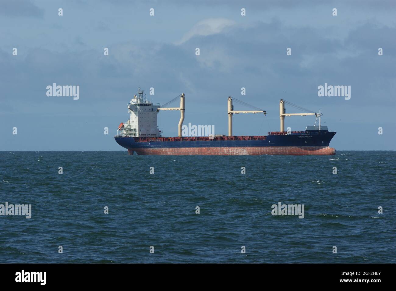 Empty container ship lies at anchor at Helgoland Stock Photo - Alamy