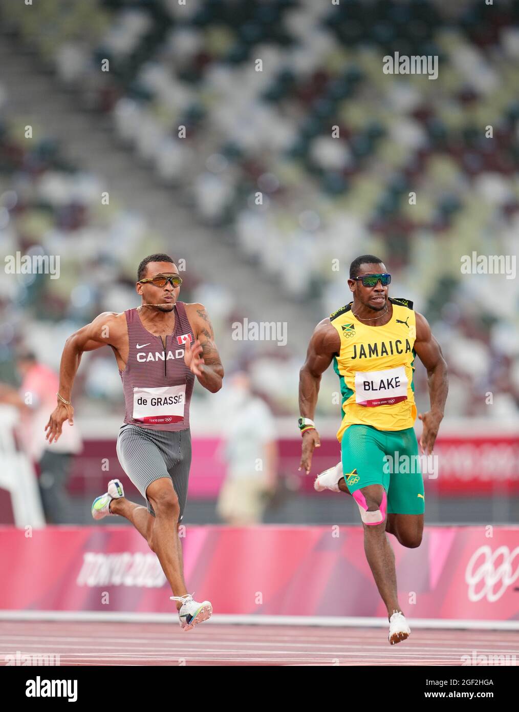 Andre De Grasse running the 100 meters at the 2020 Tokyo Olympics Stock ...