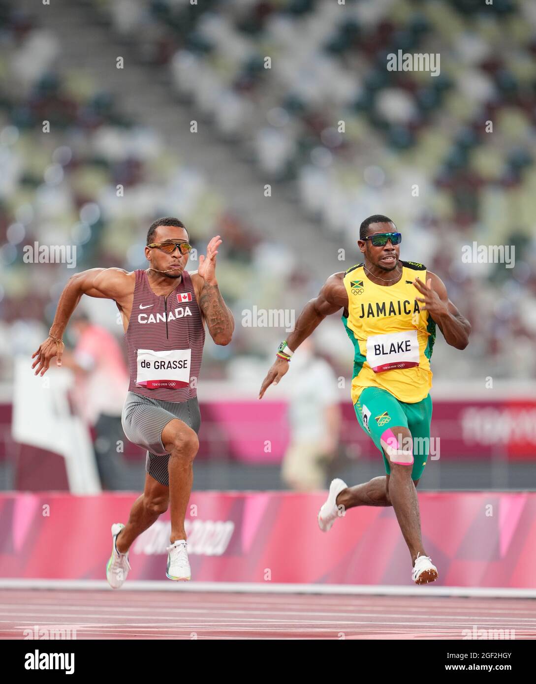 Andre De Grasse running the 100 meters at the 2020 Tokyo Olympics Stock ...