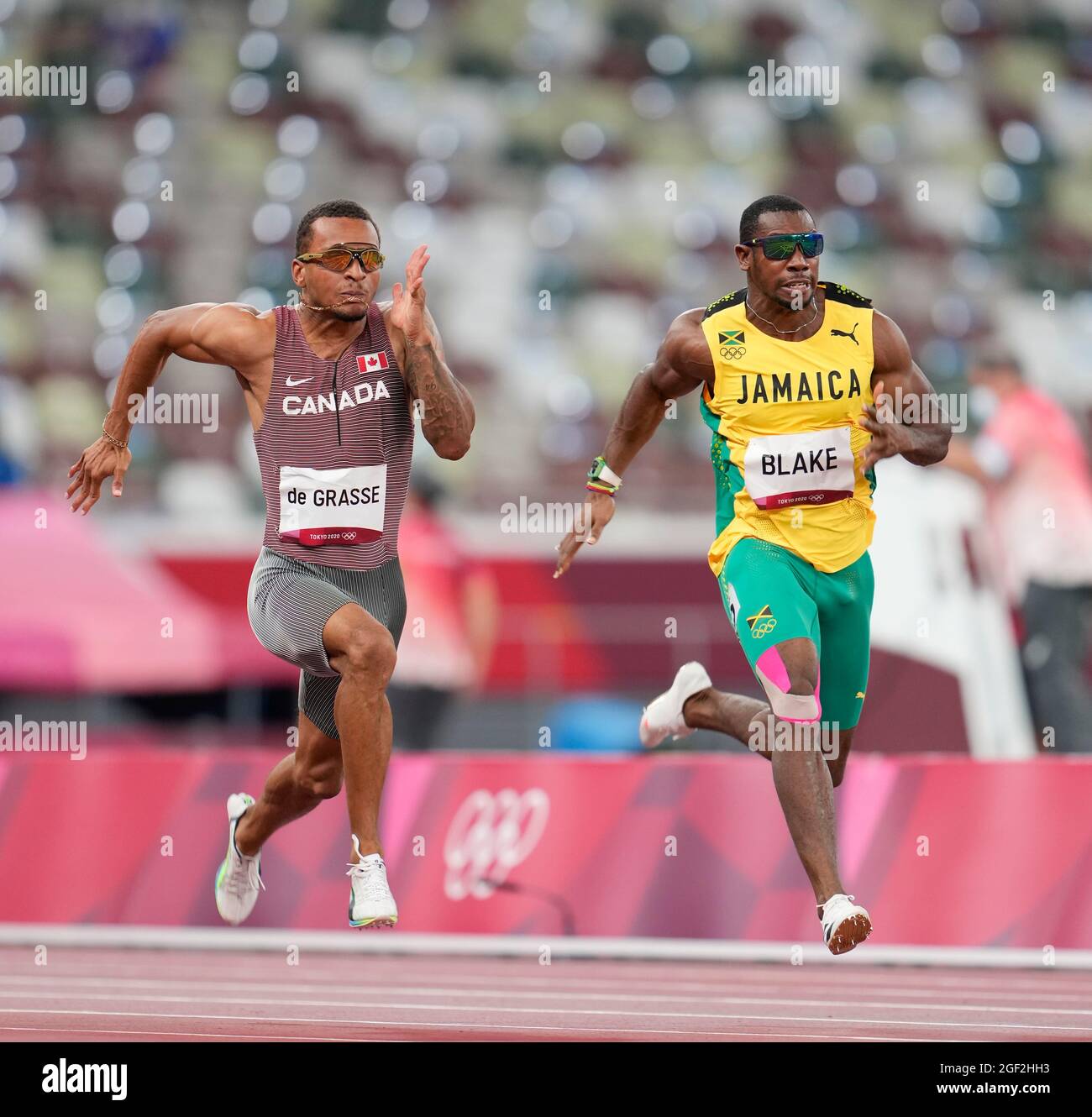 Andre De Grasse running the 100 meters at the 2020 Tokyo Olympics Stock ...