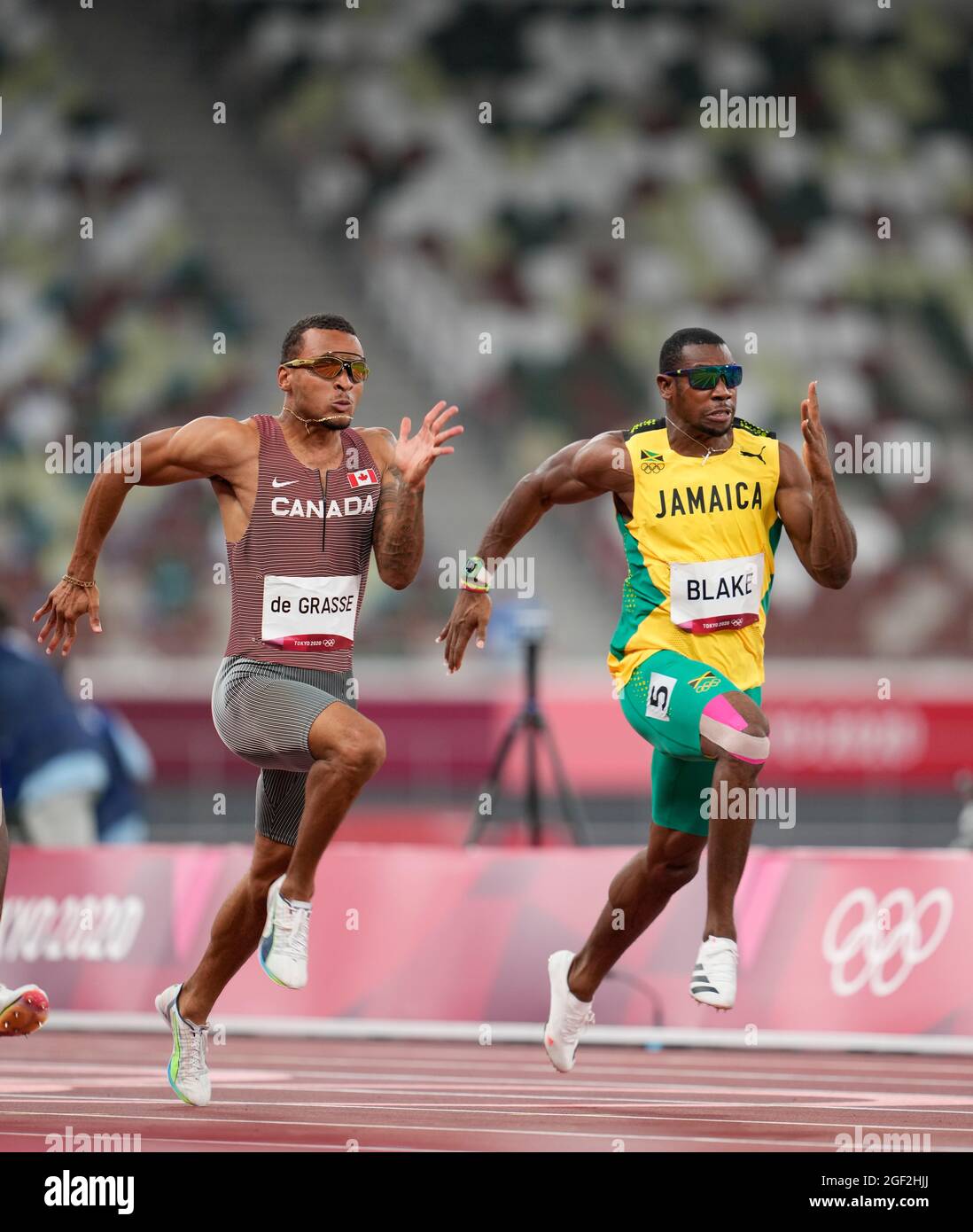 Andre De Grasse running the 100 meters at the 2020 Tokyo Olympics Stock ...