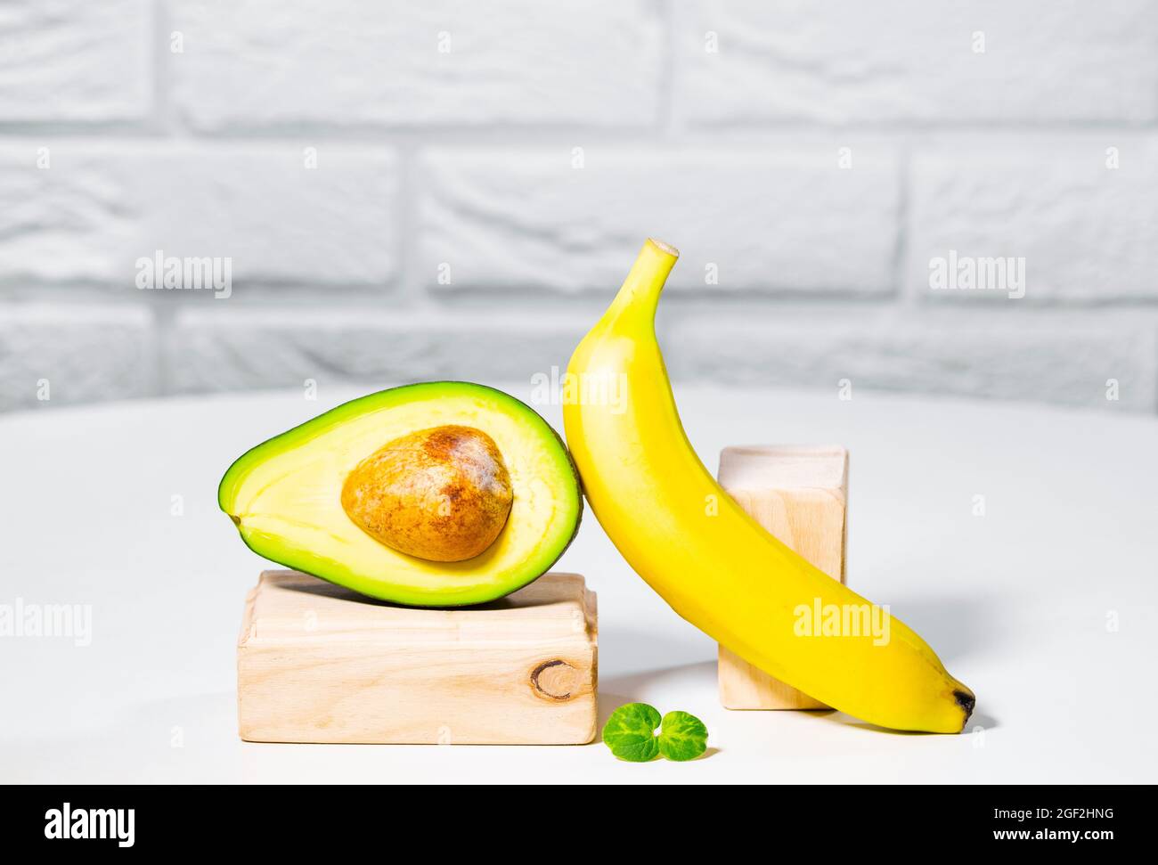 Creative avocado, banana and micro green balance wooden stands and ...