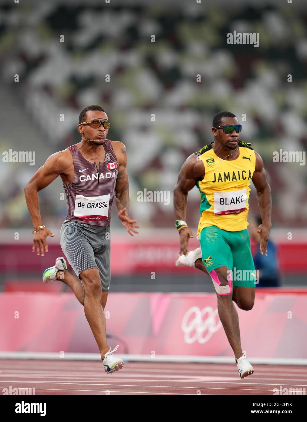 Andre De Grasse running the 100 meters at the 2020 Tokyo Olympics Stock ...