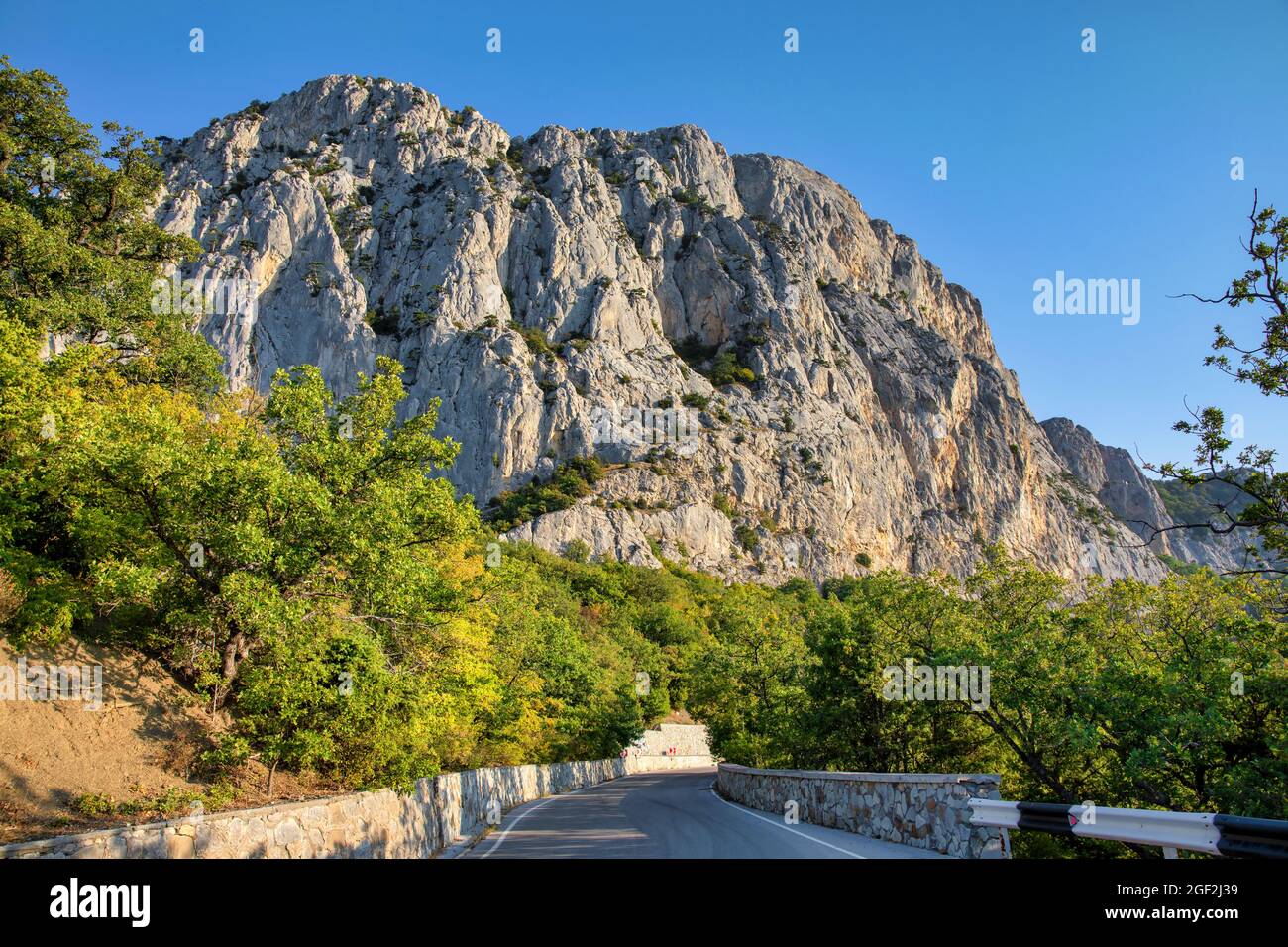 Road between mountains Stock Photo - Alamy