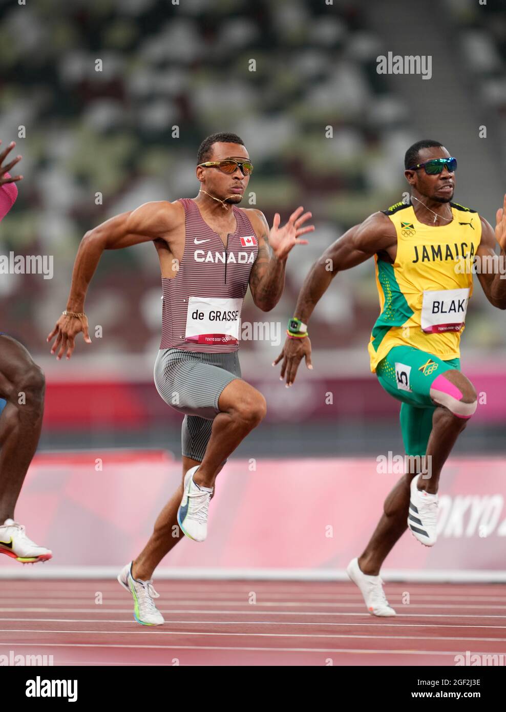 Andre De Grasse running the 100 meters at the 2020 Tokyo Olympics Stock ...
