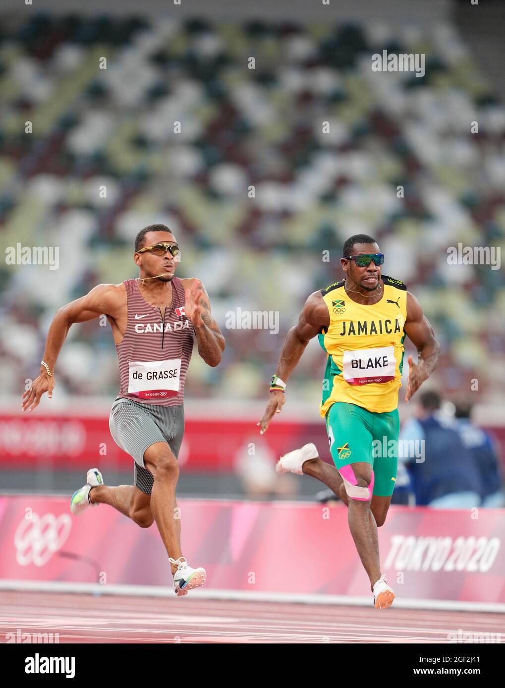 Andre De Grasse running the 100 meters at the 2020 Tokyo Olympics Stock ...