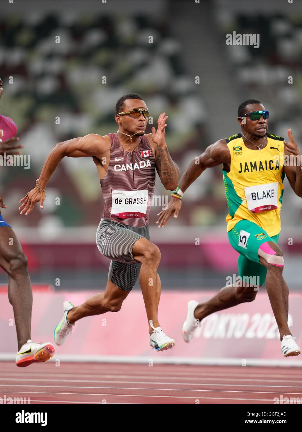 Andre De Grasse running the 100 meters at the 2020 Tokyo Olympics Stock ...