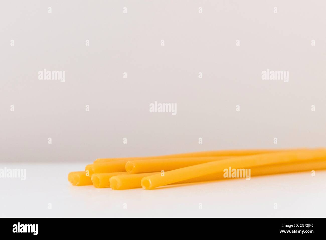 Eco-friendly pasta straws on light background with copy space Stock ...
