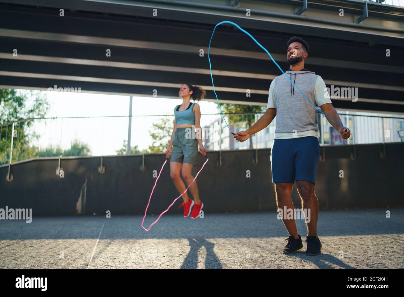 Woman skipping rope outdoors hi-res stock photography and images - Alamy