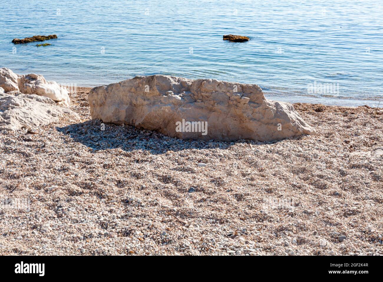 Bright summer morning in Numana, Italy with a rock on the beautiful ...