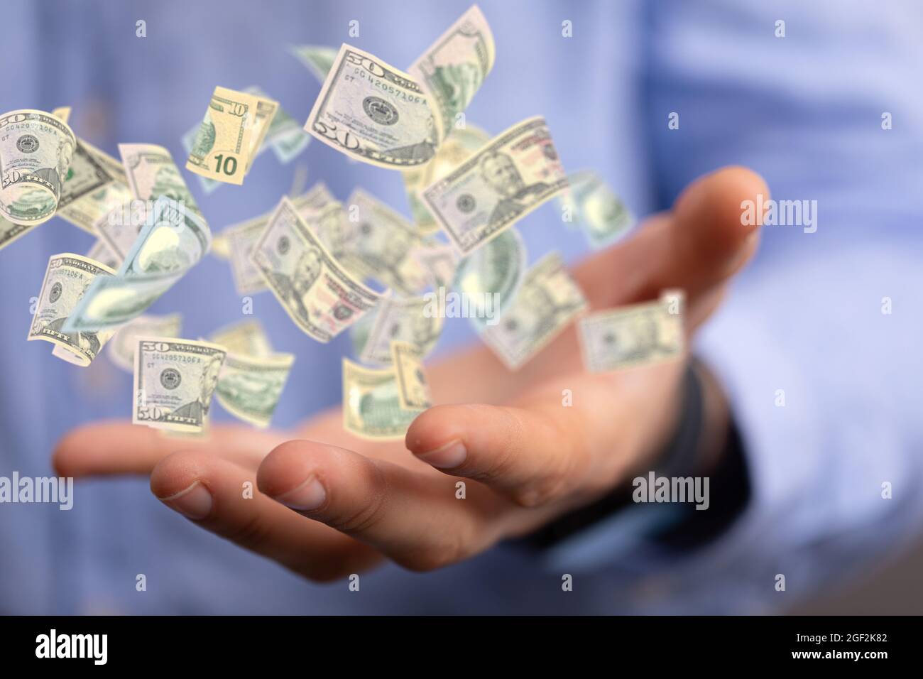 Person holding a 3D render of floating dollar banknotes Stock Photo - Alamy