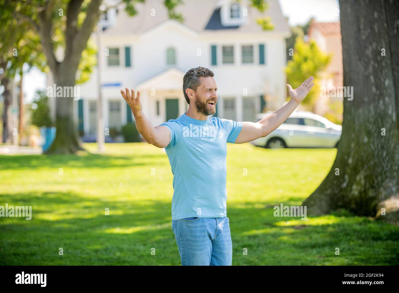happy mature man standing outdoor at house, success Stock Photo - Alamy