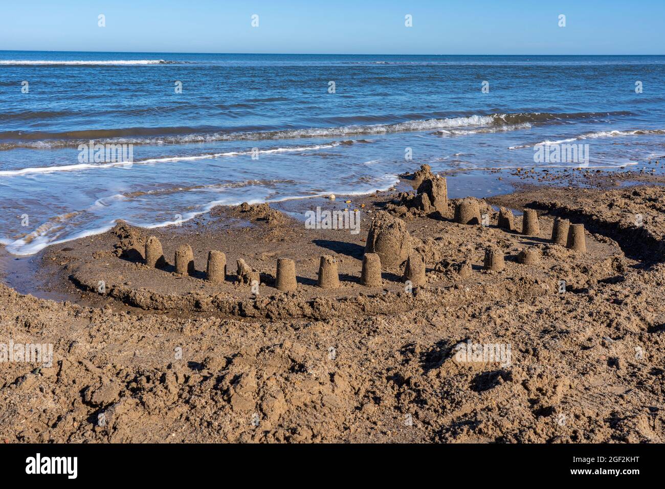 sandcastle about to be destroyed by sea, saltburn, north yorkshire, uk ...