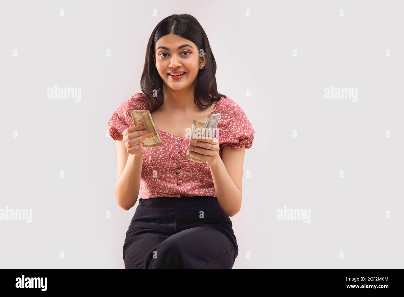Indian woman counting money hi-res stock photography and images - Alamy