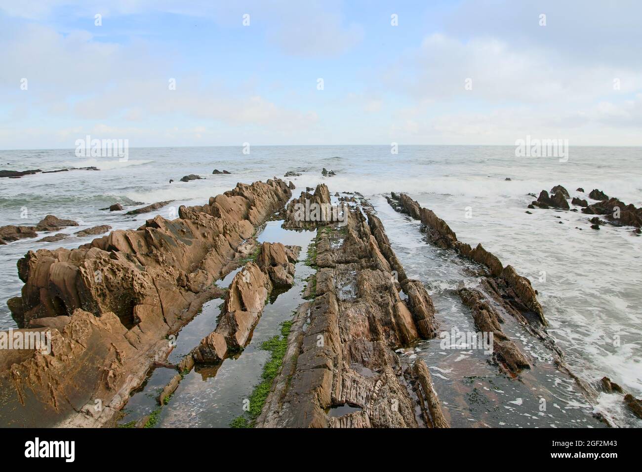Beautiful view of the wavy South Atlantic ocean hitting the rocky beach ...