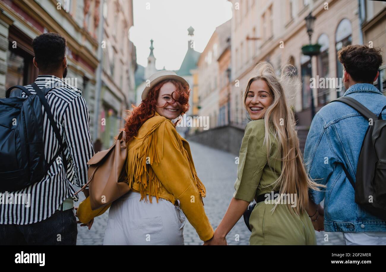 Back view happy group people hi-res stock photography and images - Alamy