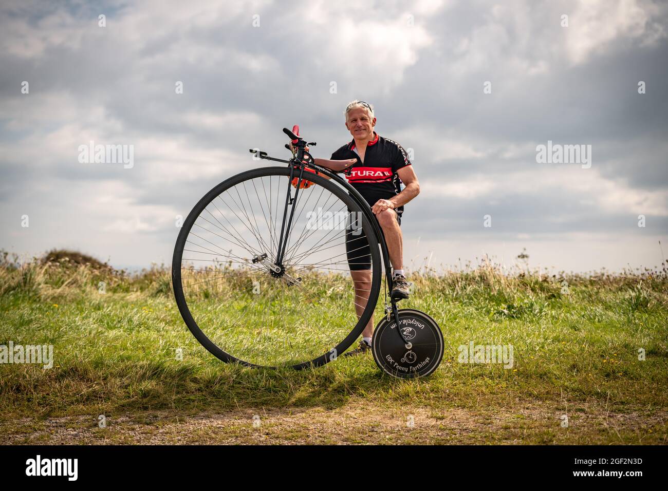 Winner of penny farthing world championships climb hi-res stock ...