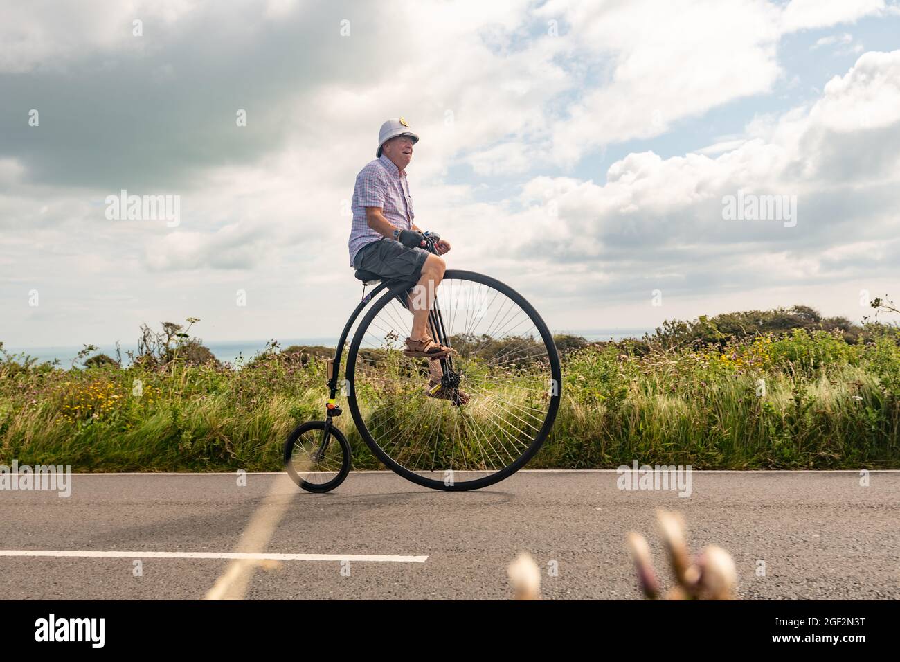 A cyclist having raced up to Beachy Head from Eastbourne for the Beachy ...