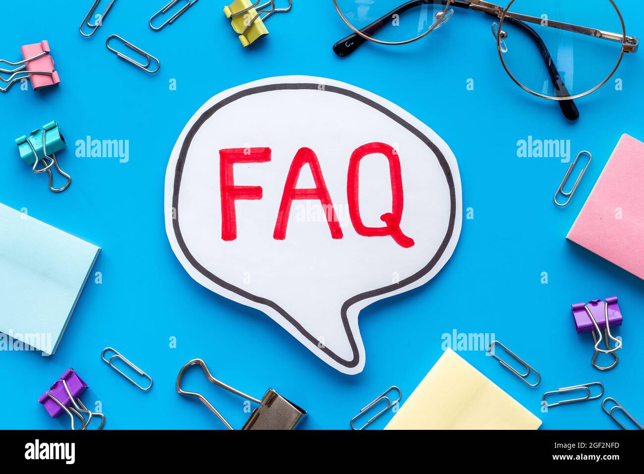 Word faq frequently asked questions with stationery on working place ...