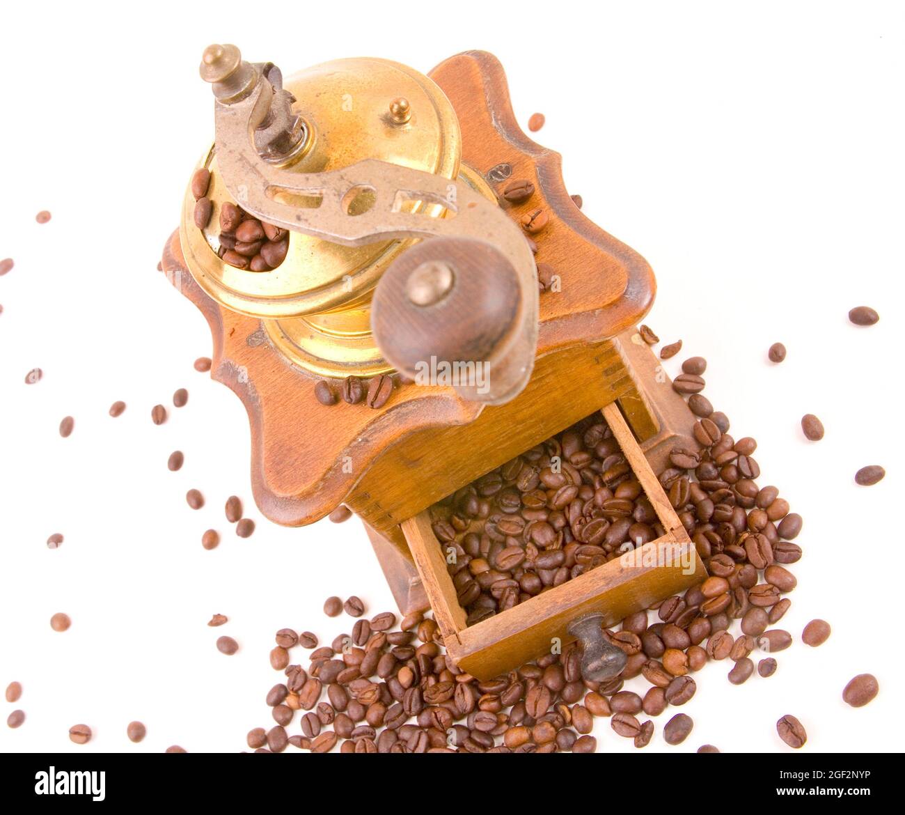 old-fashioned manual coffee mill with roasted coffee beans Stock Photo ...
