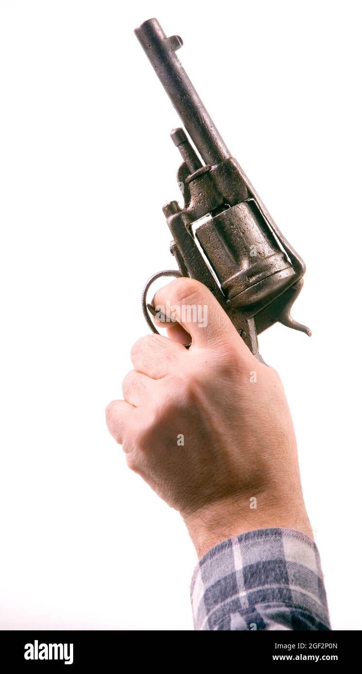 aiming with an old revolver Stock Photo - Alamy