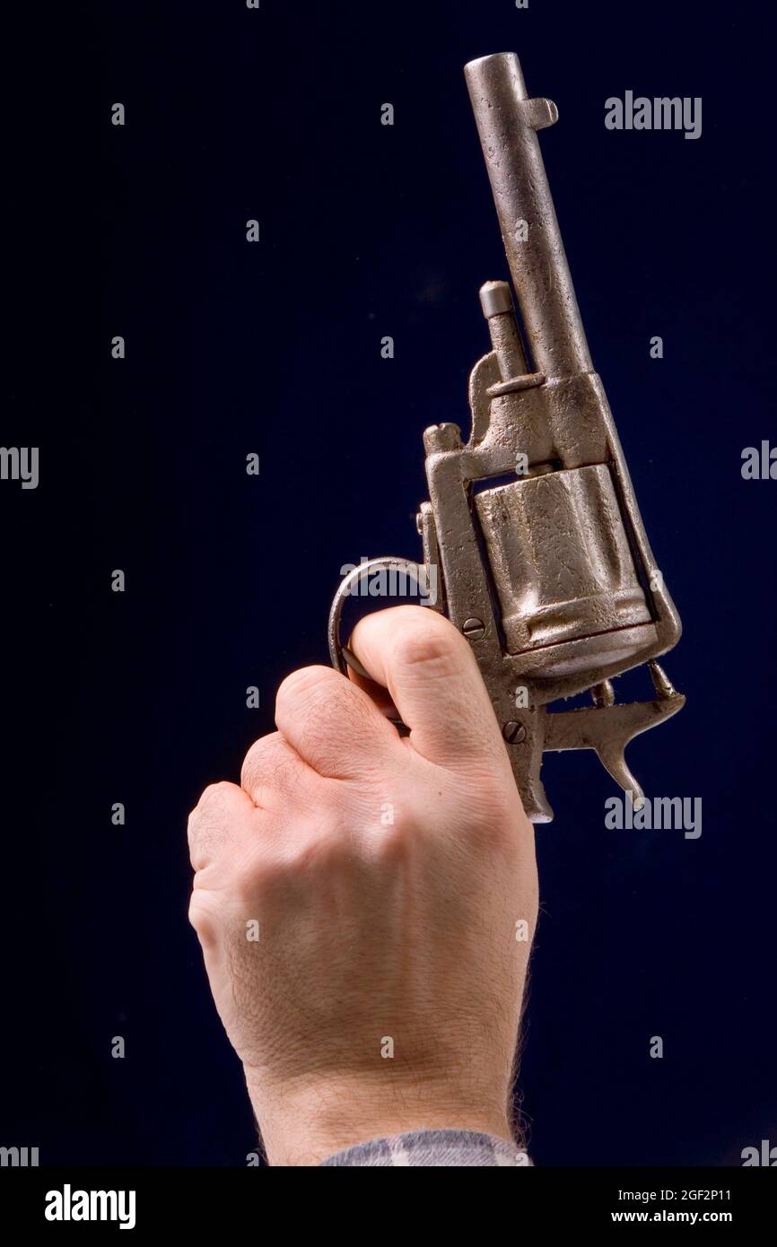 aiming with an old revolver Stock Photo - Alamy